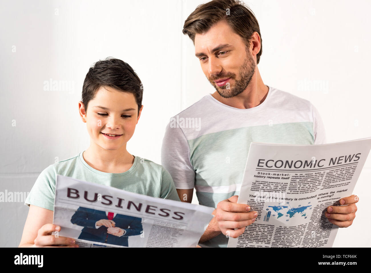 Boy father reading newspapers hi-res stock photography and images - Alamy