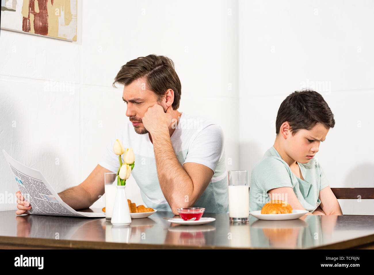 Father and son reading newspaper hi-res stock photography and images ...