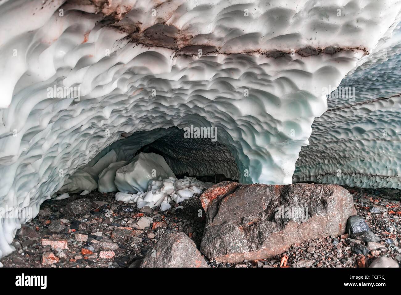 Entrance of an ice cave of a glacier, Big Four Ice Caves, Okanogan ...