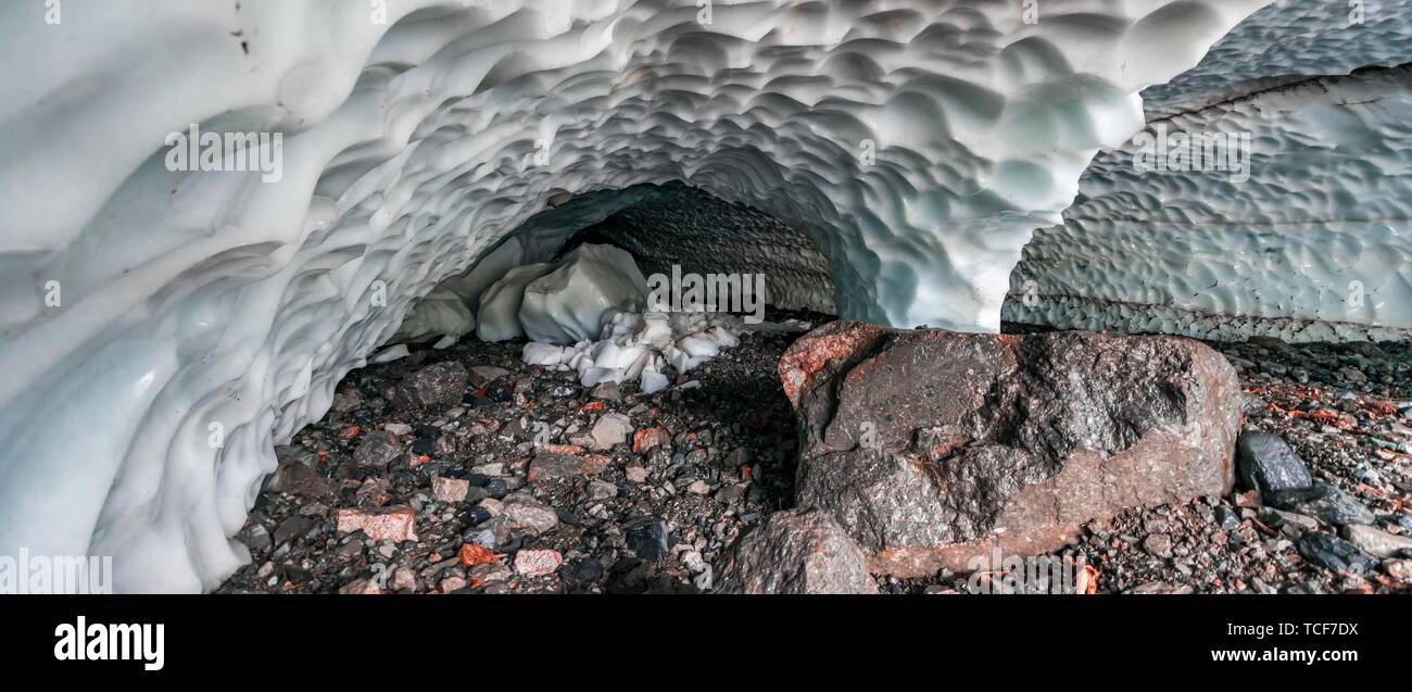Entrance of an ice cave of a glacier, Big Four Ice Caves, Okanogan ...