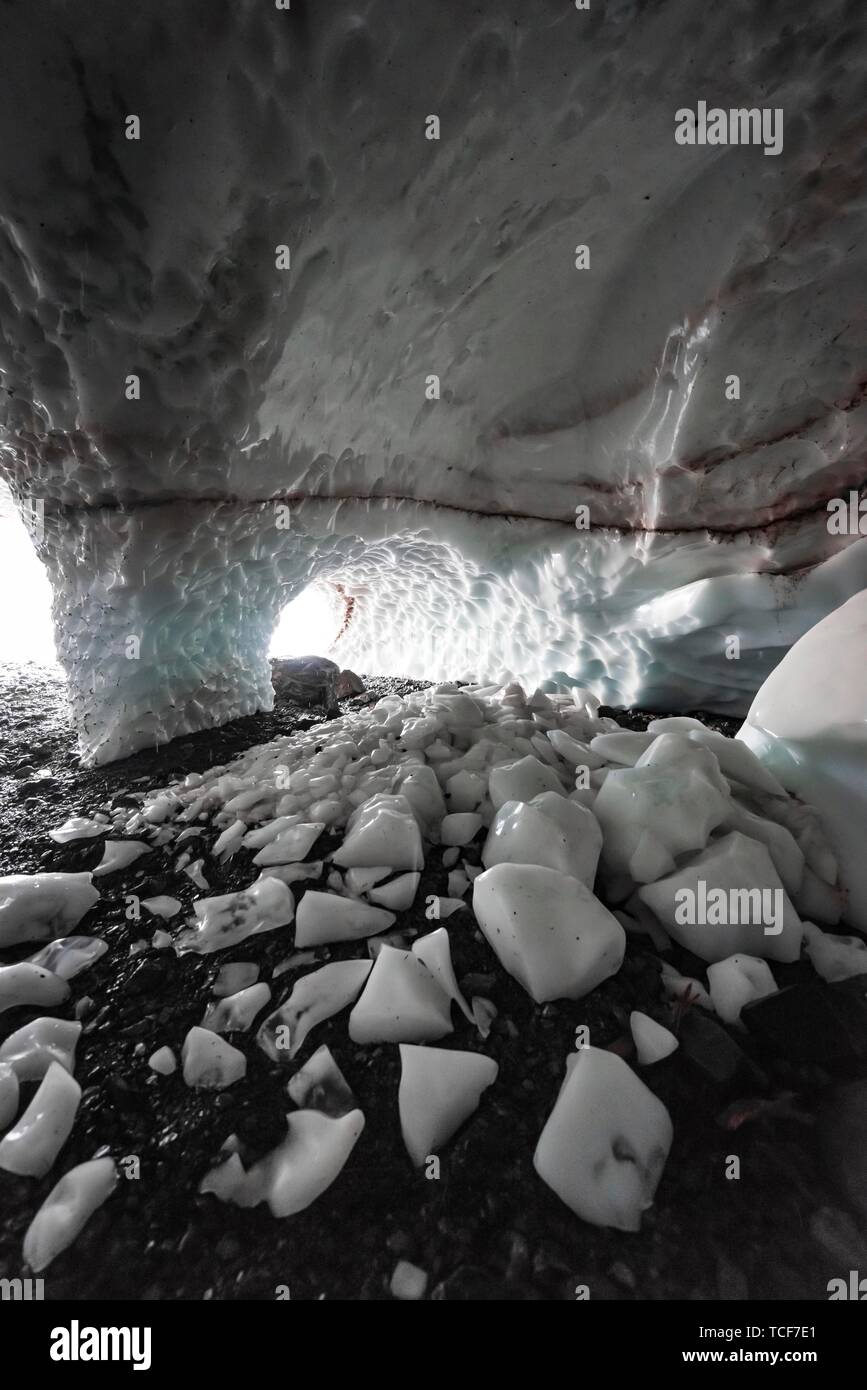Entrance of an ice cave of a glacier, Big Four Ice Caves, Okanogan ...