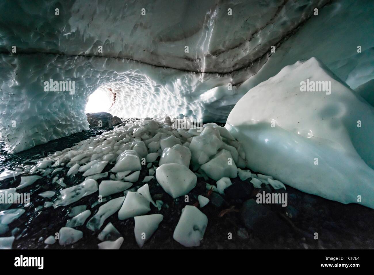 Entrance of an ice cave of a glacier, Big Four Ice Caves, Okanogan ...