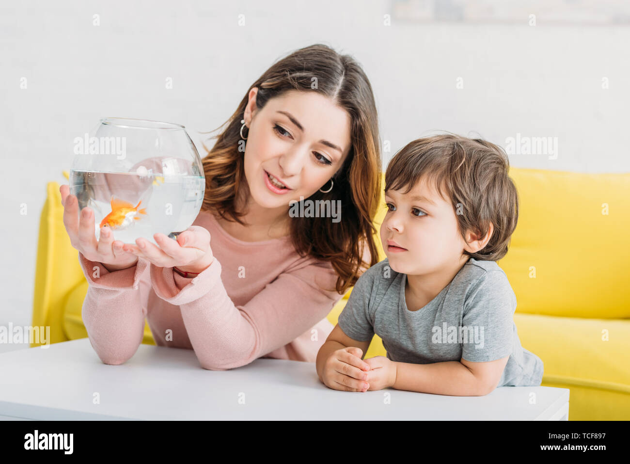 Mother holding fish hi-res stock photography and images - Alamy