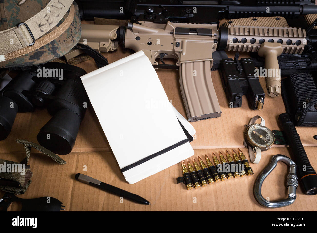Assault rifle, gun, knife with sheath, compass Stock Photo - Alamy