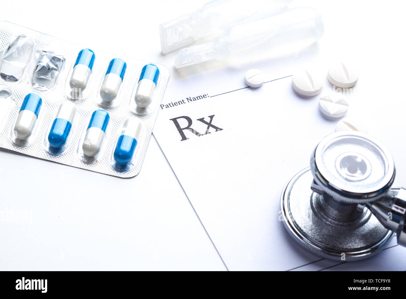 Empty prescription lying on table with stethoscope Stock Photo - Alamy