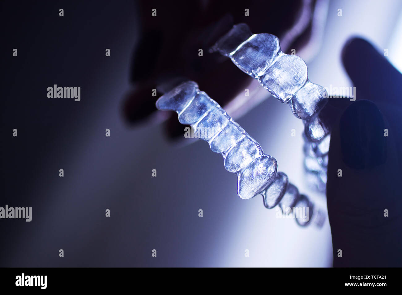 Clear dental teeth retainer brackets to straighten and align each tooth ...