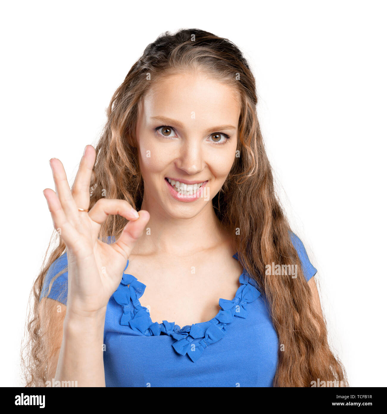 Beautiful young woman showing Ok sign Stock Photo - Alamy