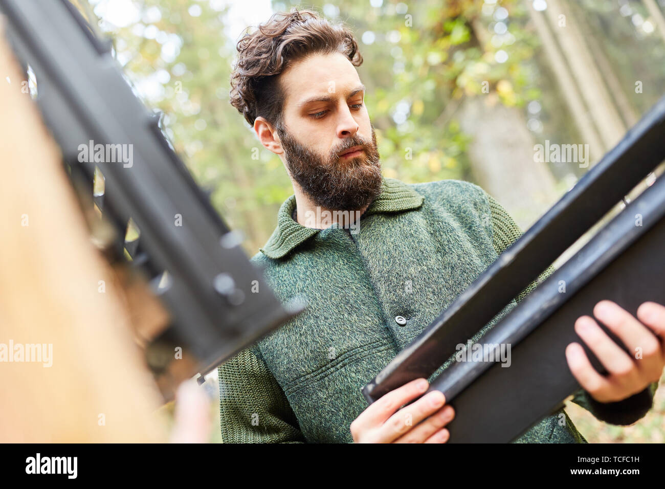 Ranger looks at a bark beetle trap as a means of pest control Stock ...