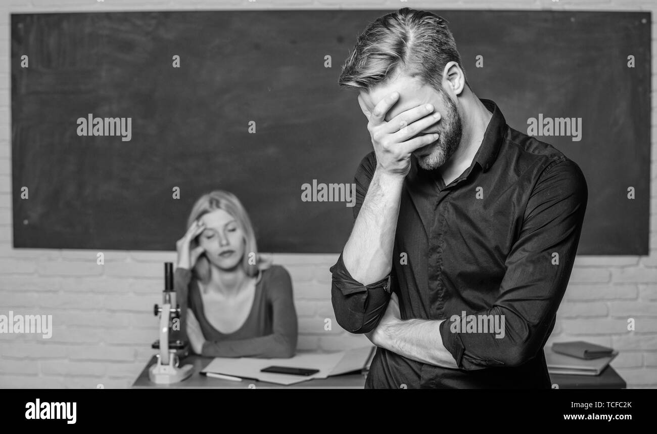 Male teacher teaching in a classroom Black and White Stock Photos ...