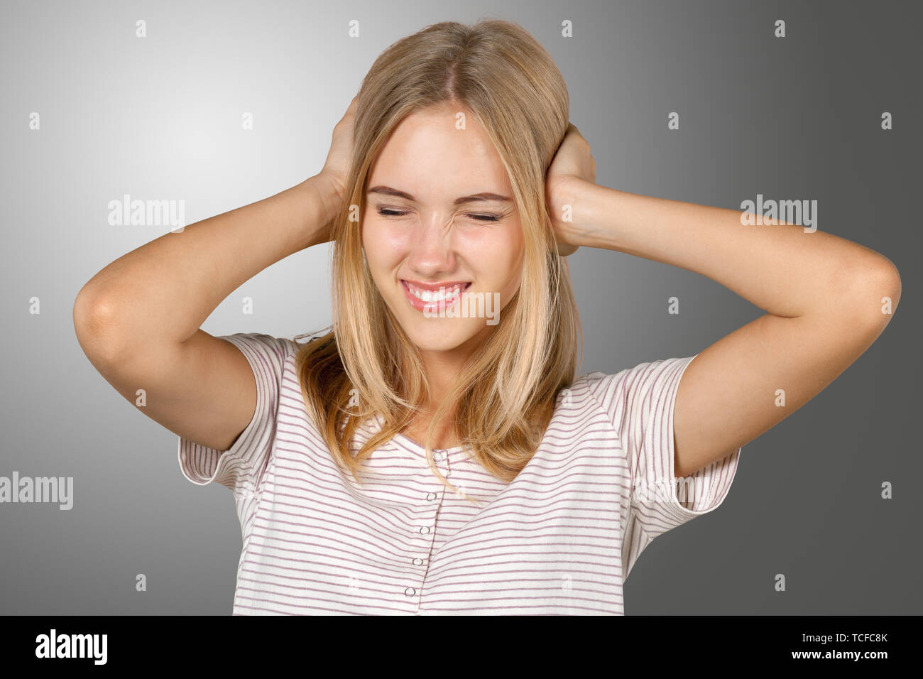 Blonde girl irritated and stressed Stock Photo - Alamy