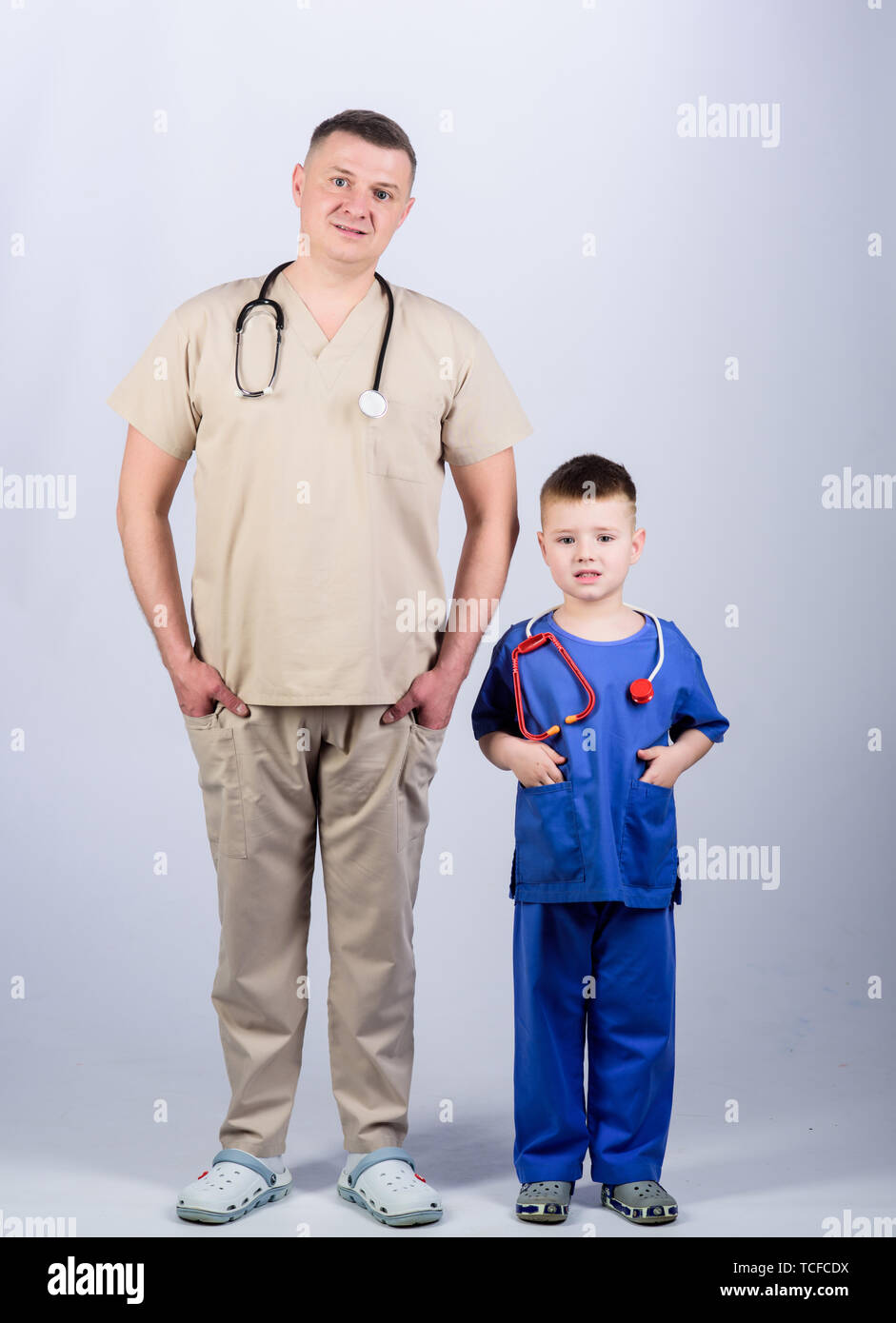 medicine and health. happy child with father with stethoscope. family ...