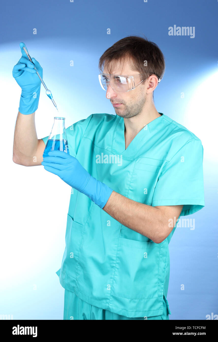 scientist in the lab working with chemicals test-tubes Stock Photo - Alamy