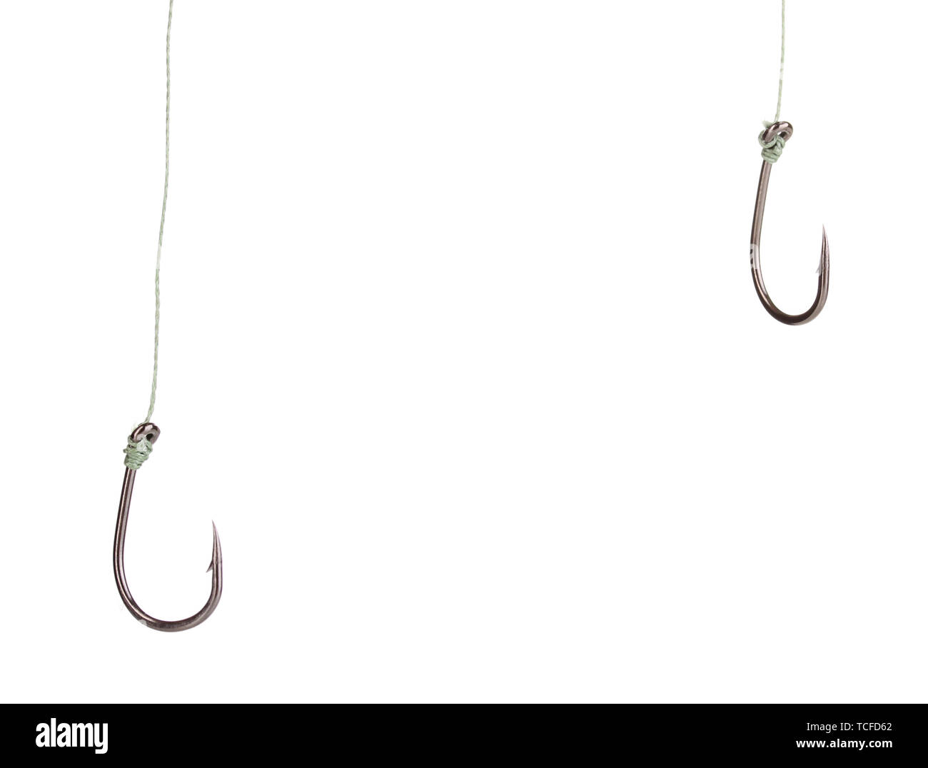 Two single fish hooks isolated on white Stock Photo - Alamy