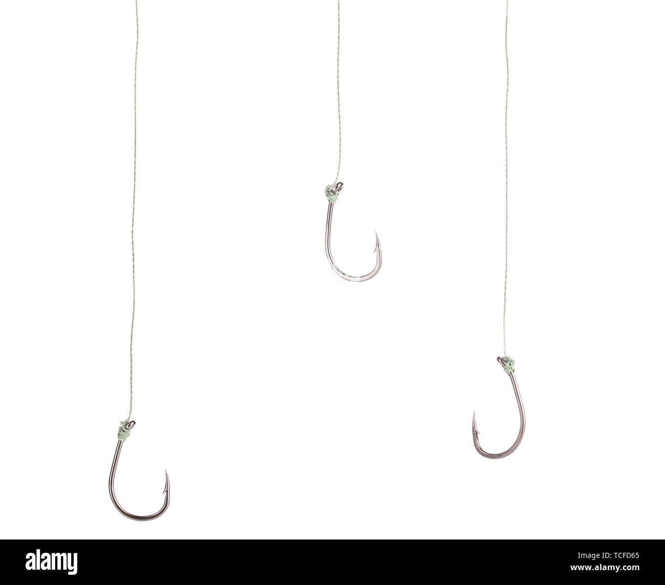 Three single fish hooks isolated on white Stock Photo - Alamy