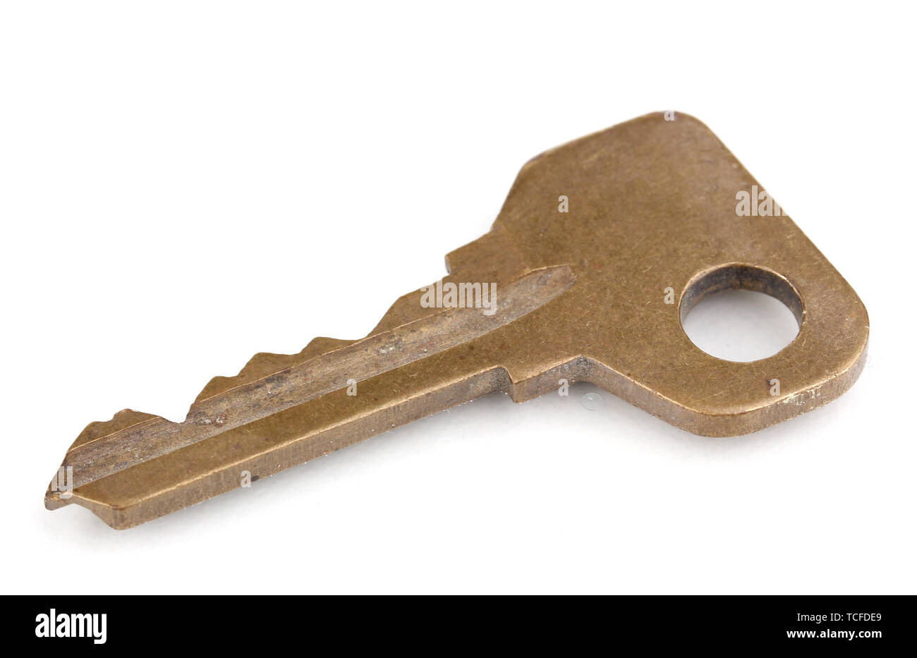 Metal key isolated on white Stock Photo - Alamy