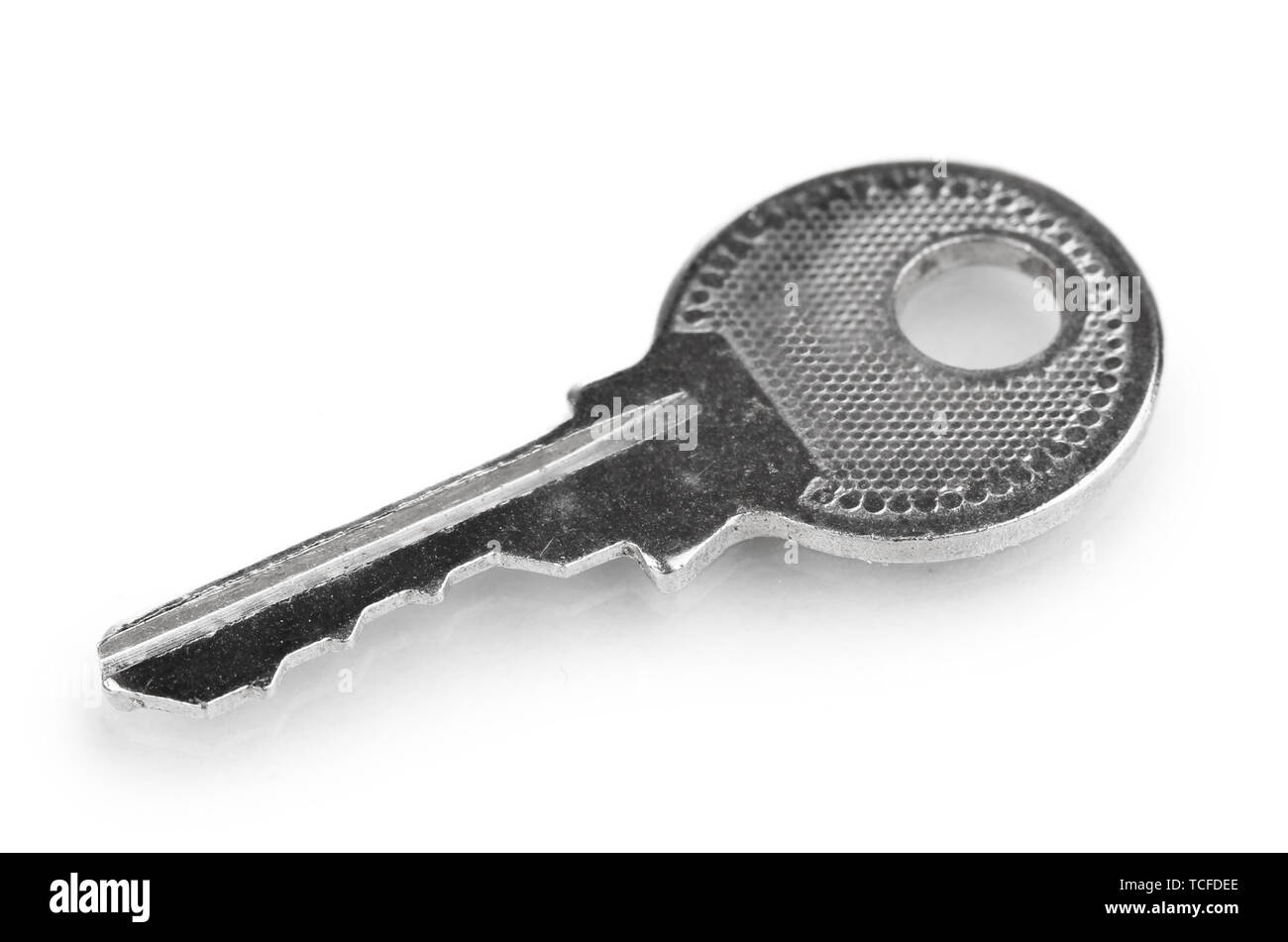 Metal key isolated on white Stock Photo - Alamy