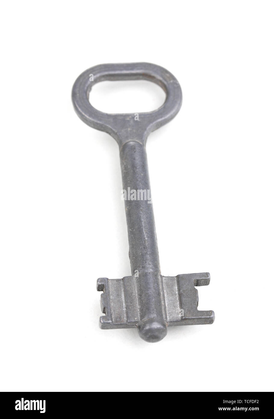 Metal key isolated on white Stock Photo - Alamy
