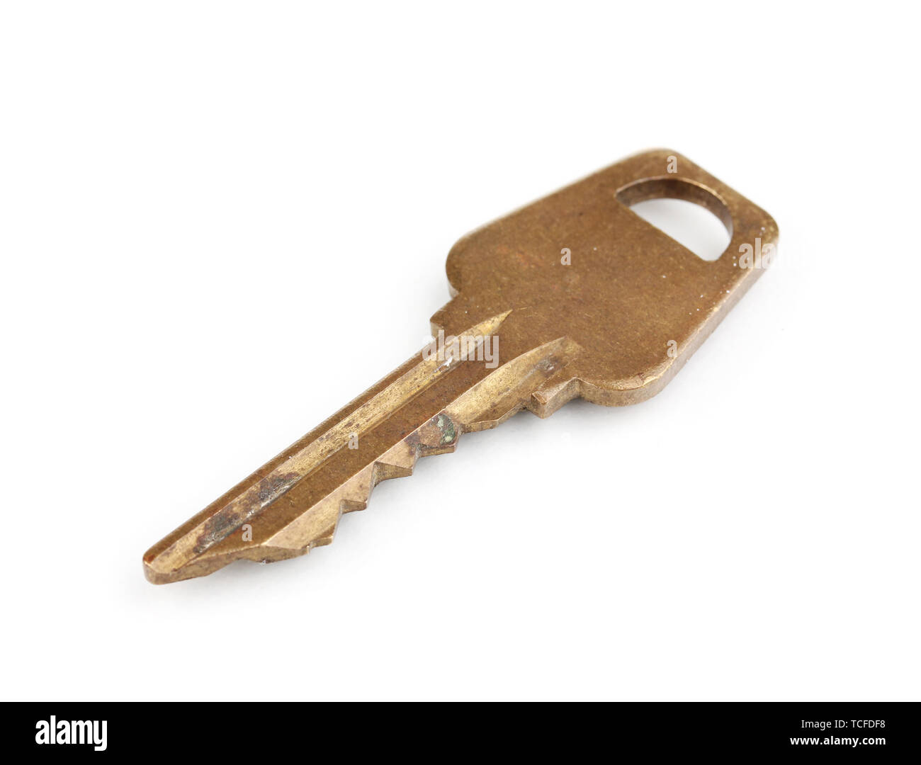 Metal key isolated on white Stock Photo - Alamy