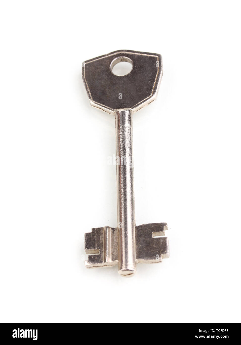 Metal key isolated on white Stock Photo - Alamy