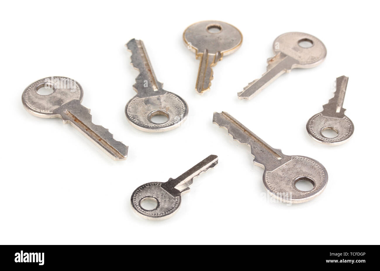 Many metal keys isolated on white Stock Photo - Alamy