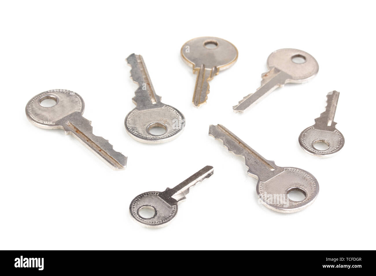 Many metal keys isolated on white Stock Photo - Alamy