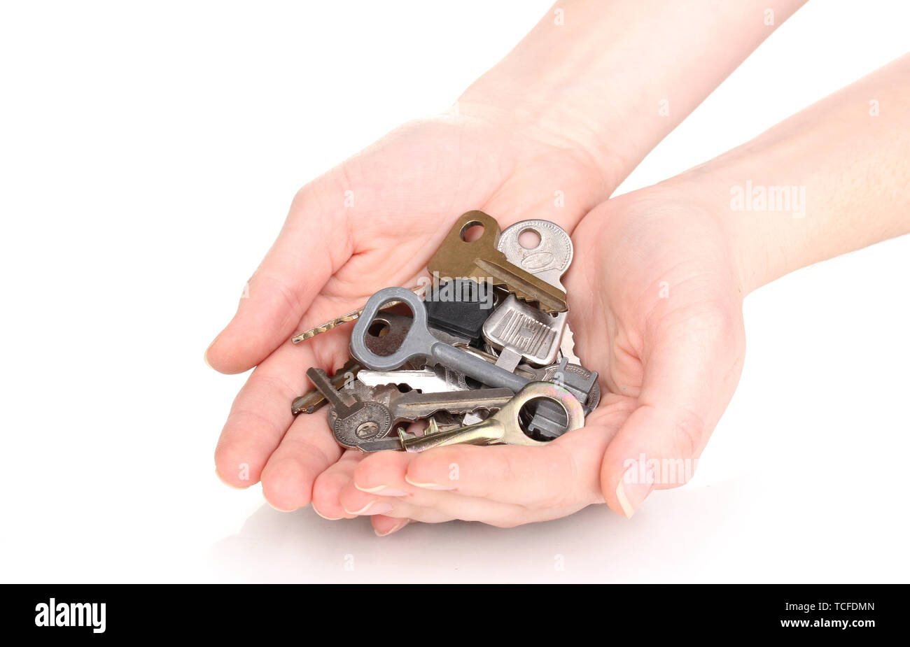 Many keys in hands isolated on white Stock Photo - Alamy