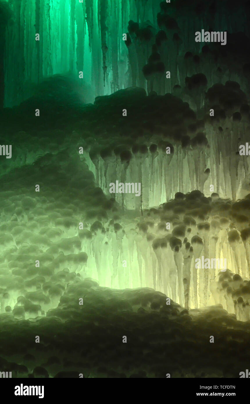 Huge ice icicles. Fragment of large blocks of ice frozen waterfall of ...