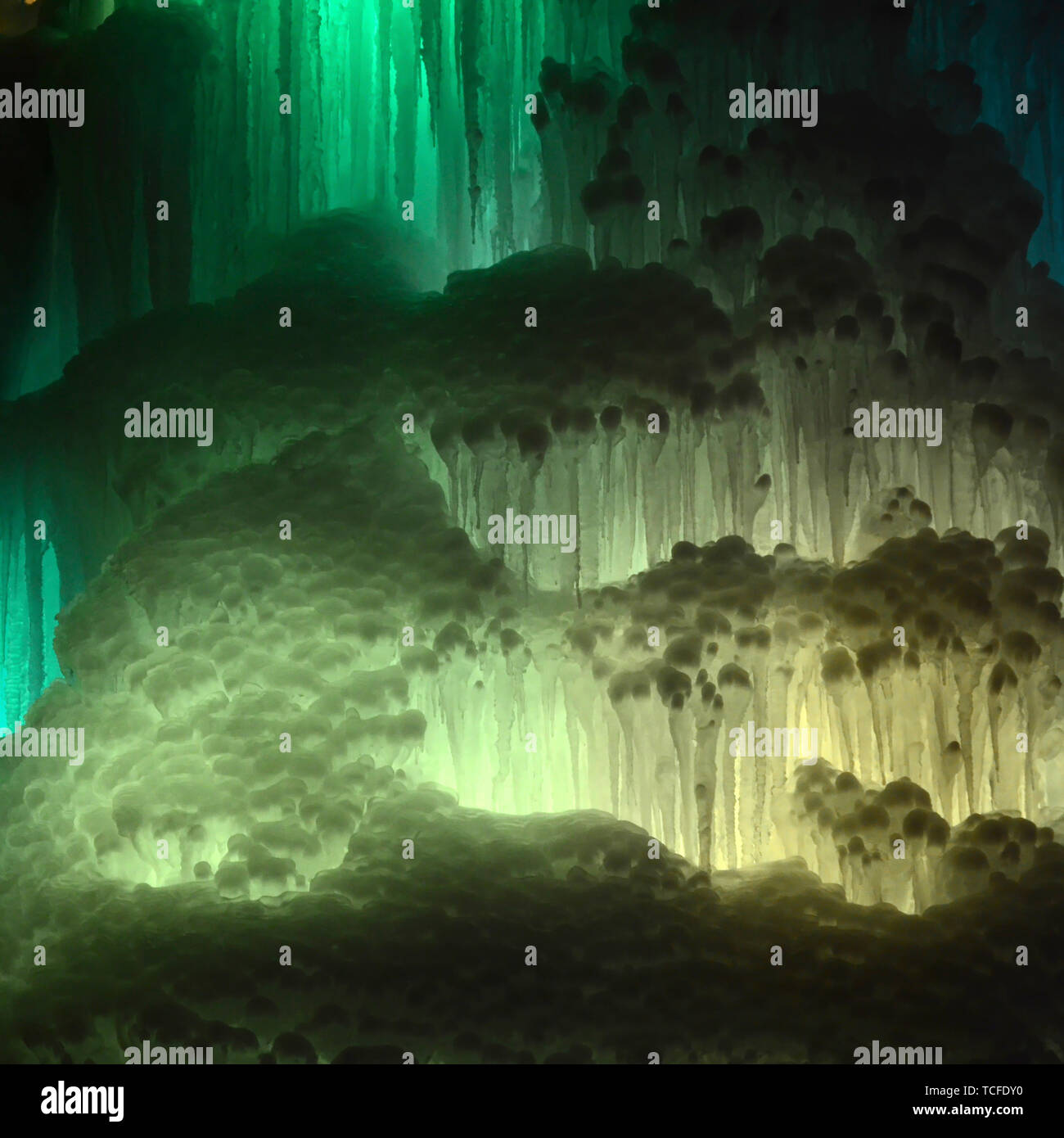 Huge ice icicles. Fragment of large blocks of ice frozen waterfall of ...