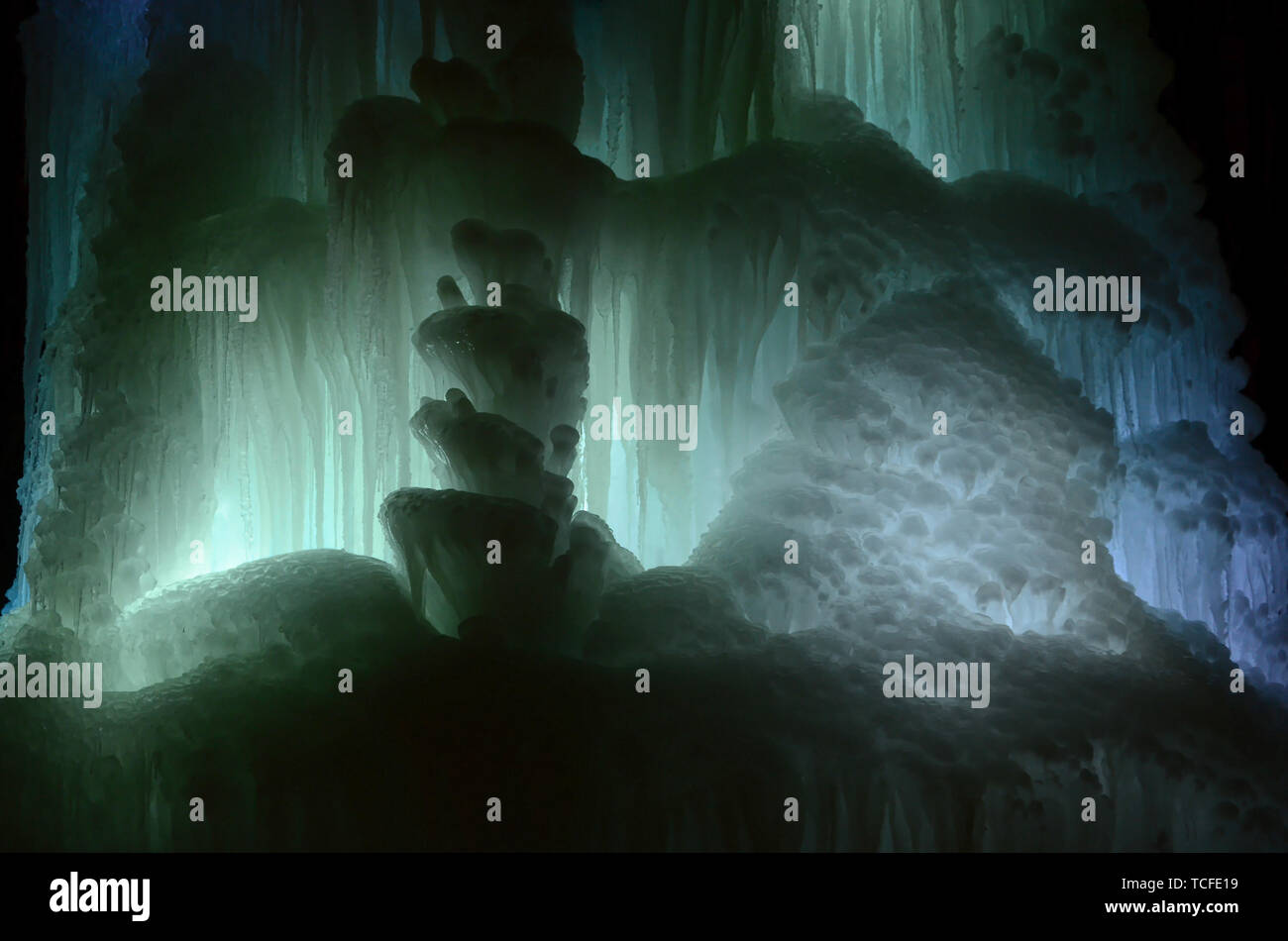 Huge ice icicles. Fragment of large blocks of ice frozen waterfall of ...