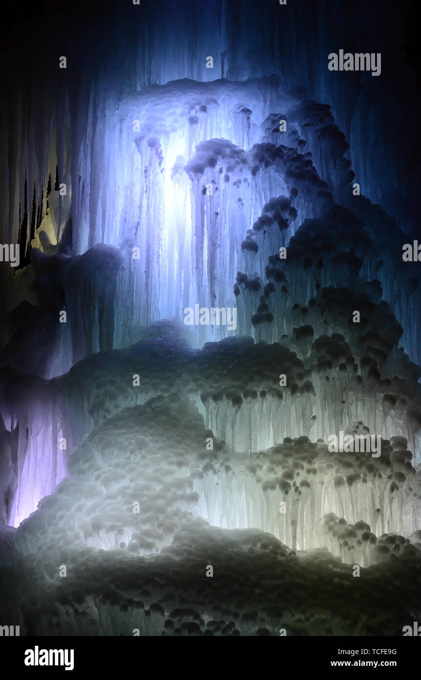 Huge ice icicles. Fragment of large blocks of ice frozen waterfall of ...