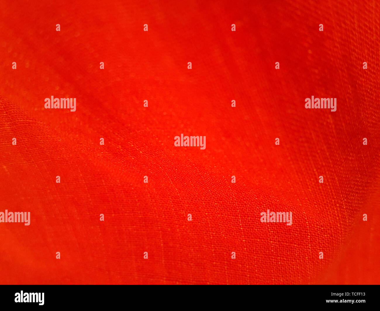 Red wavy fabric closeup background Stock Photo - Alamy