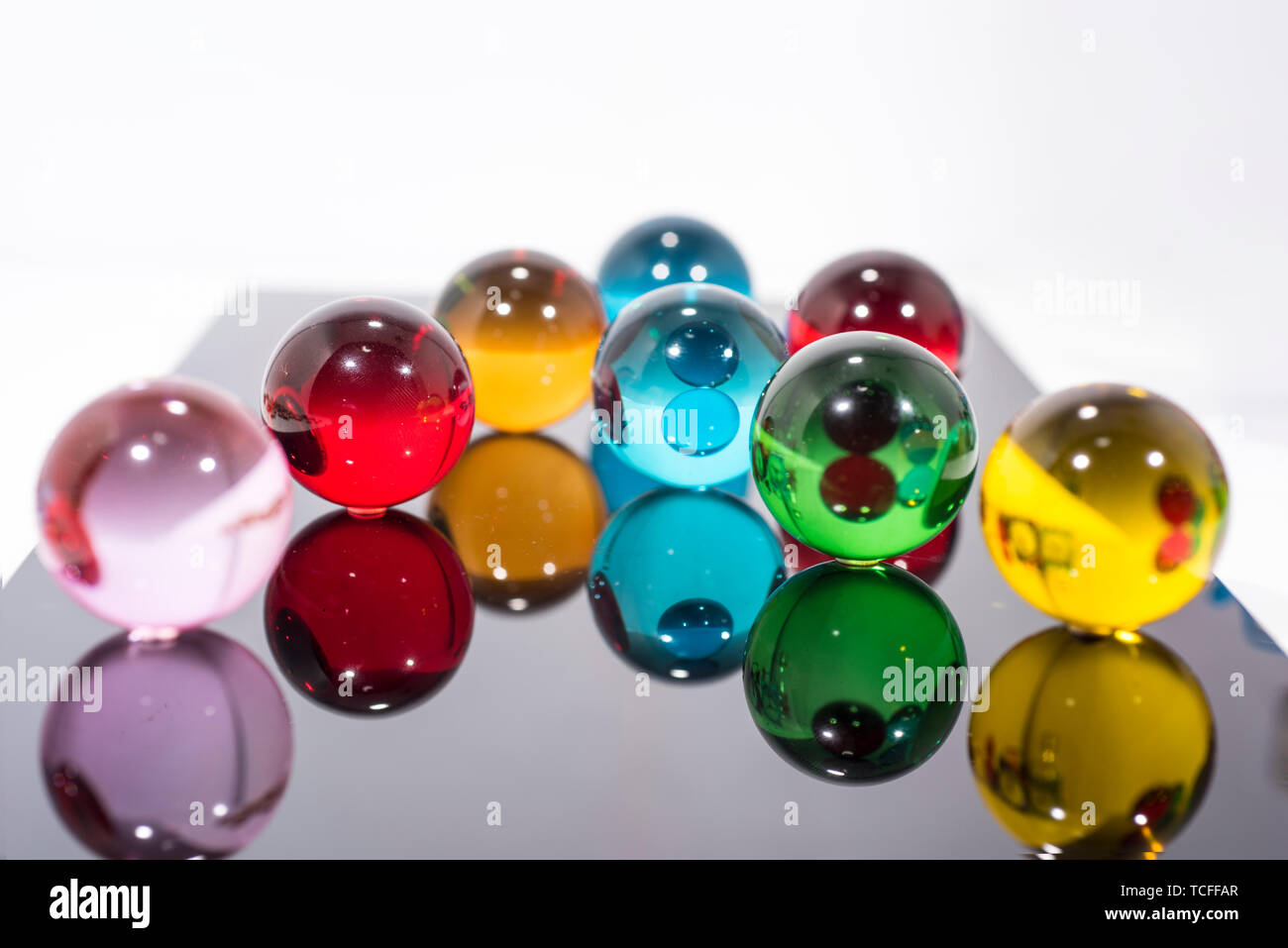 Multi colored balls in glass ball hi-res stock photography and images ...