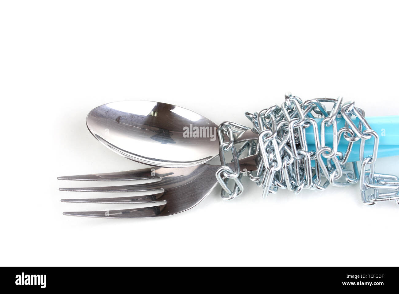 Fork and spoon with chain close-up isolated on white Stock Photo - Alamy