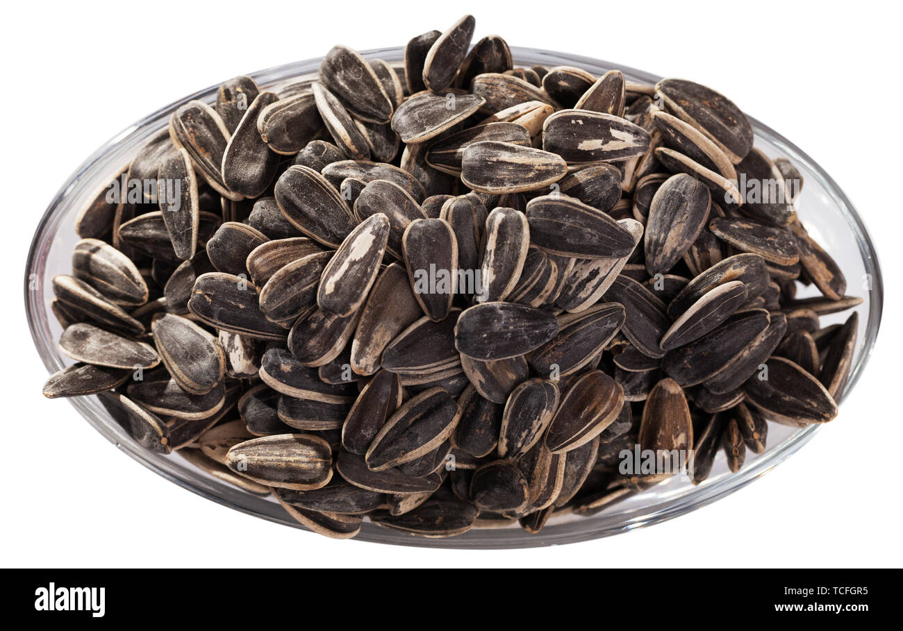 Top view of glass bowl with sunflower seeds in hulls Stock Photo - Alamy