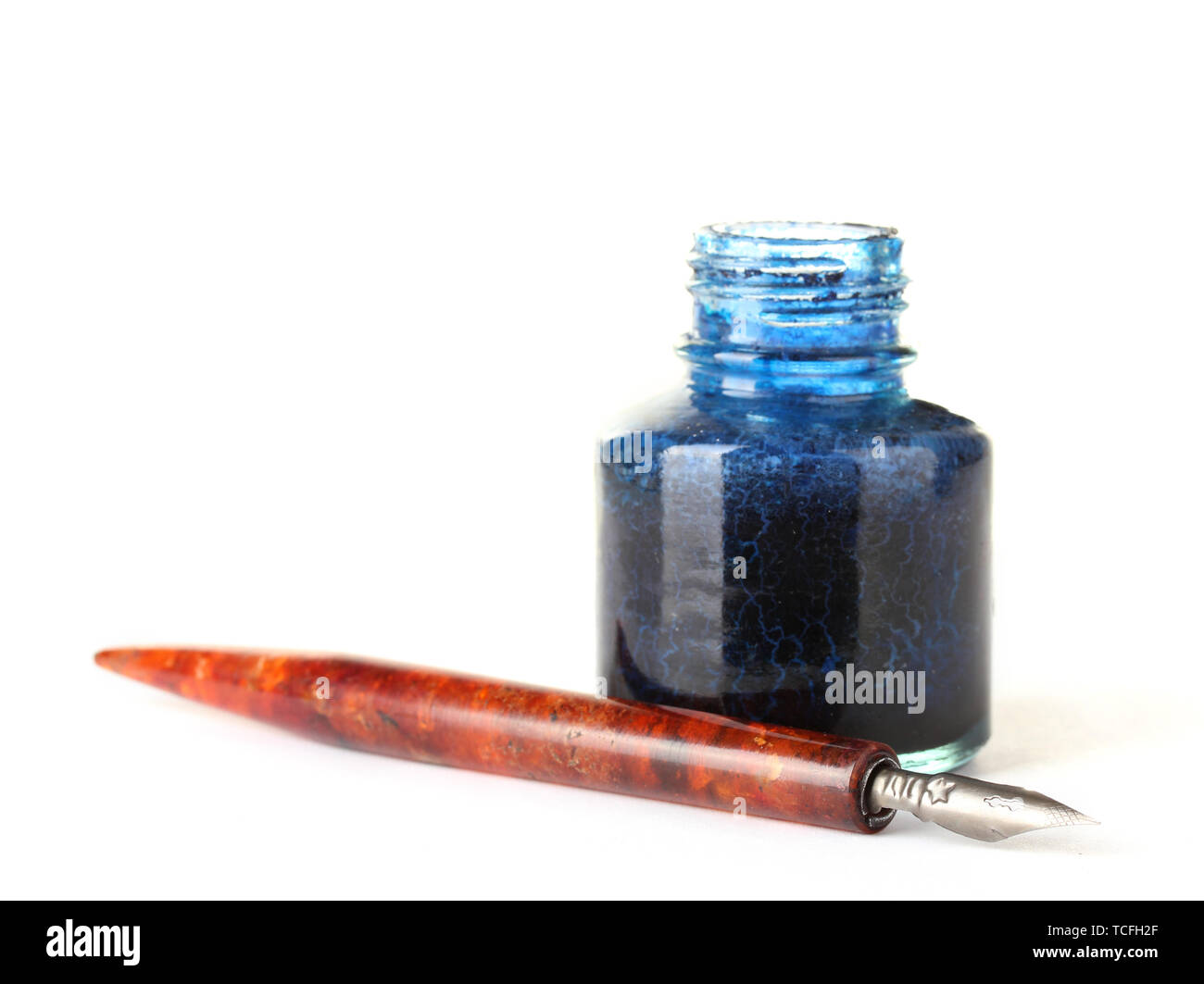 old ink pen and ink bottle isolated on white Stock Photo - Alamy