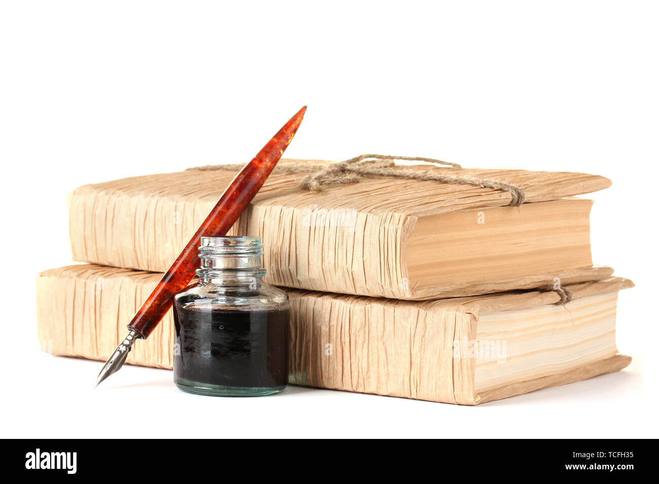 old books, ink pen and ink bottle isolated on white Stock Photo - Alamy