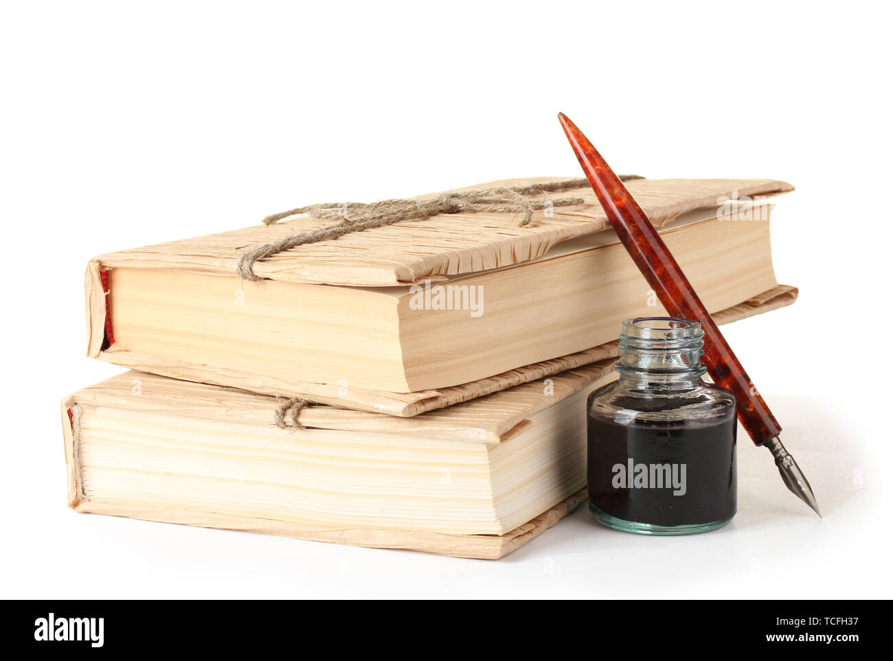 old books, ink pen and ink bottle isolated on white Stock Photo - Alamy