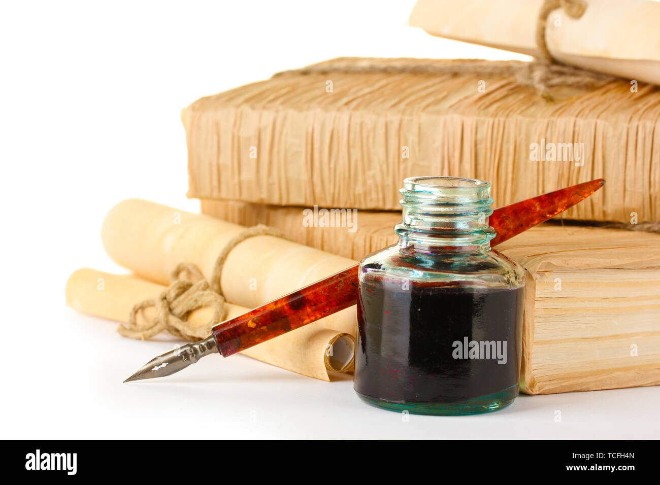 old books, ink pen and ink bottle isolated on white Stock Photo - Alamy