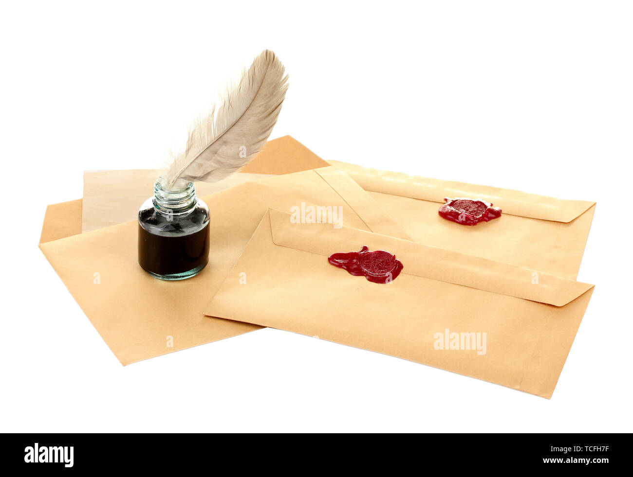 feather, ink and old letters isolated on white Stock Photo - Alamy