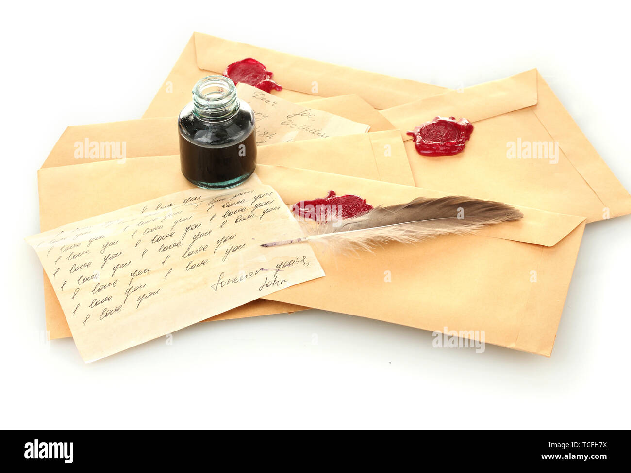 feather, ink and old letters isolated on white Stock Photo - Alamy