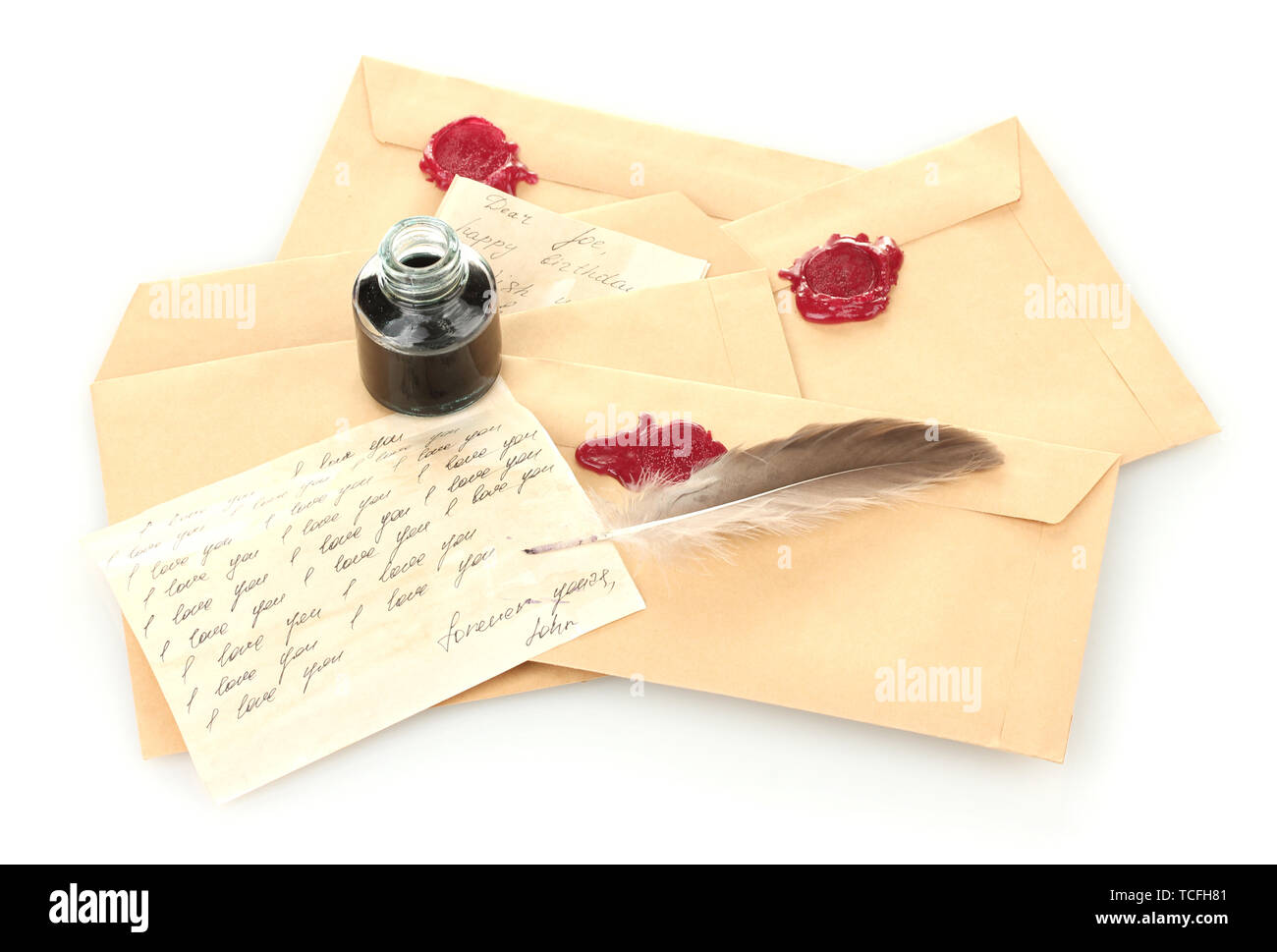 feather, ink and old letters isolated on white Stock Photo - Alamy