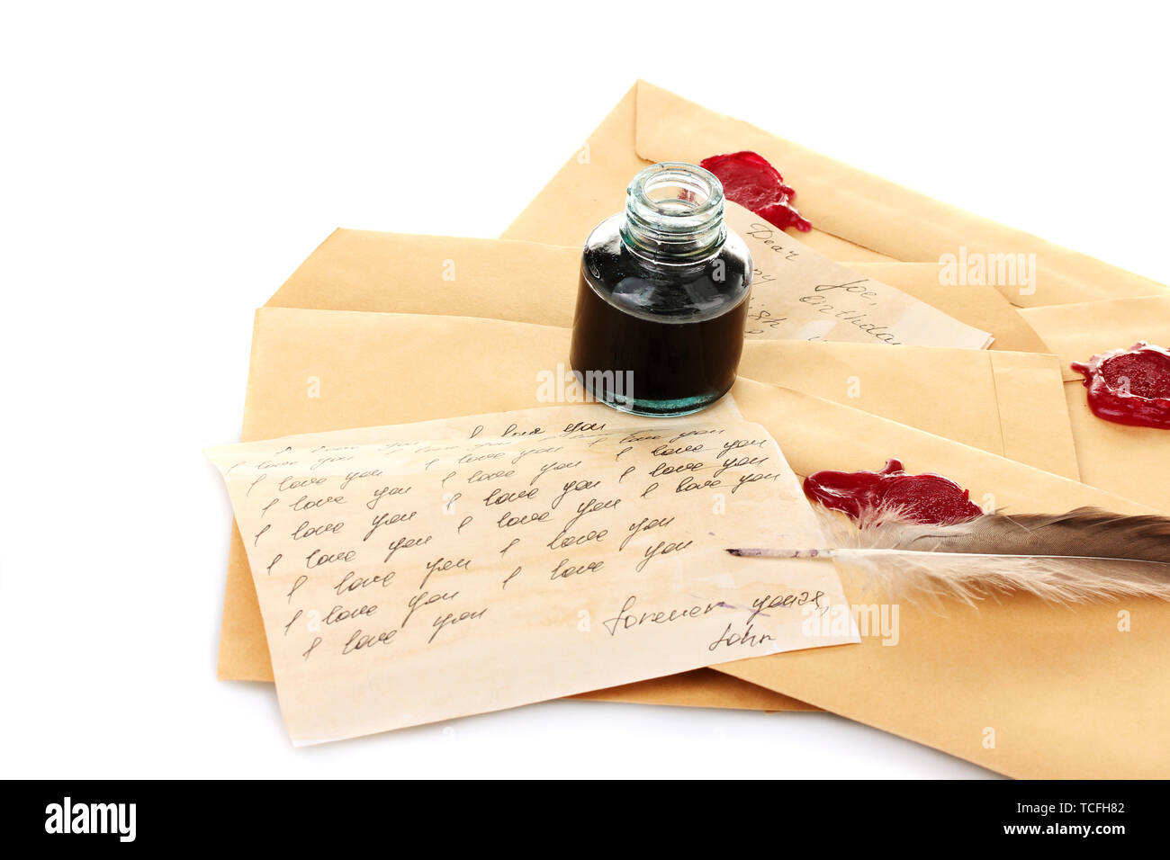 feather, ink and old letters isolated on white Stock Photo - Alamy