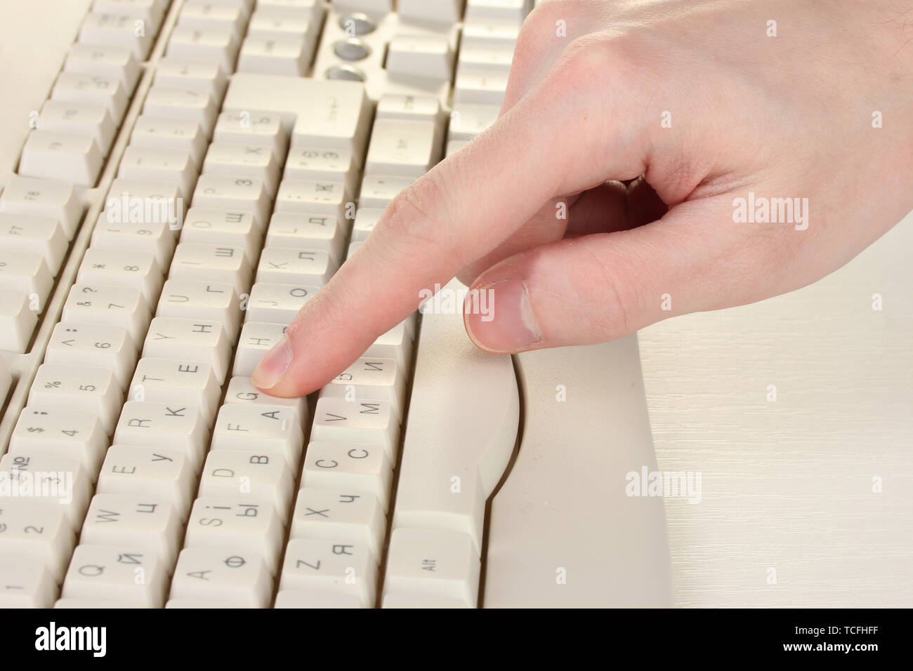 male hand typing on the keyboard isolated on white Stock Photo - Alamy