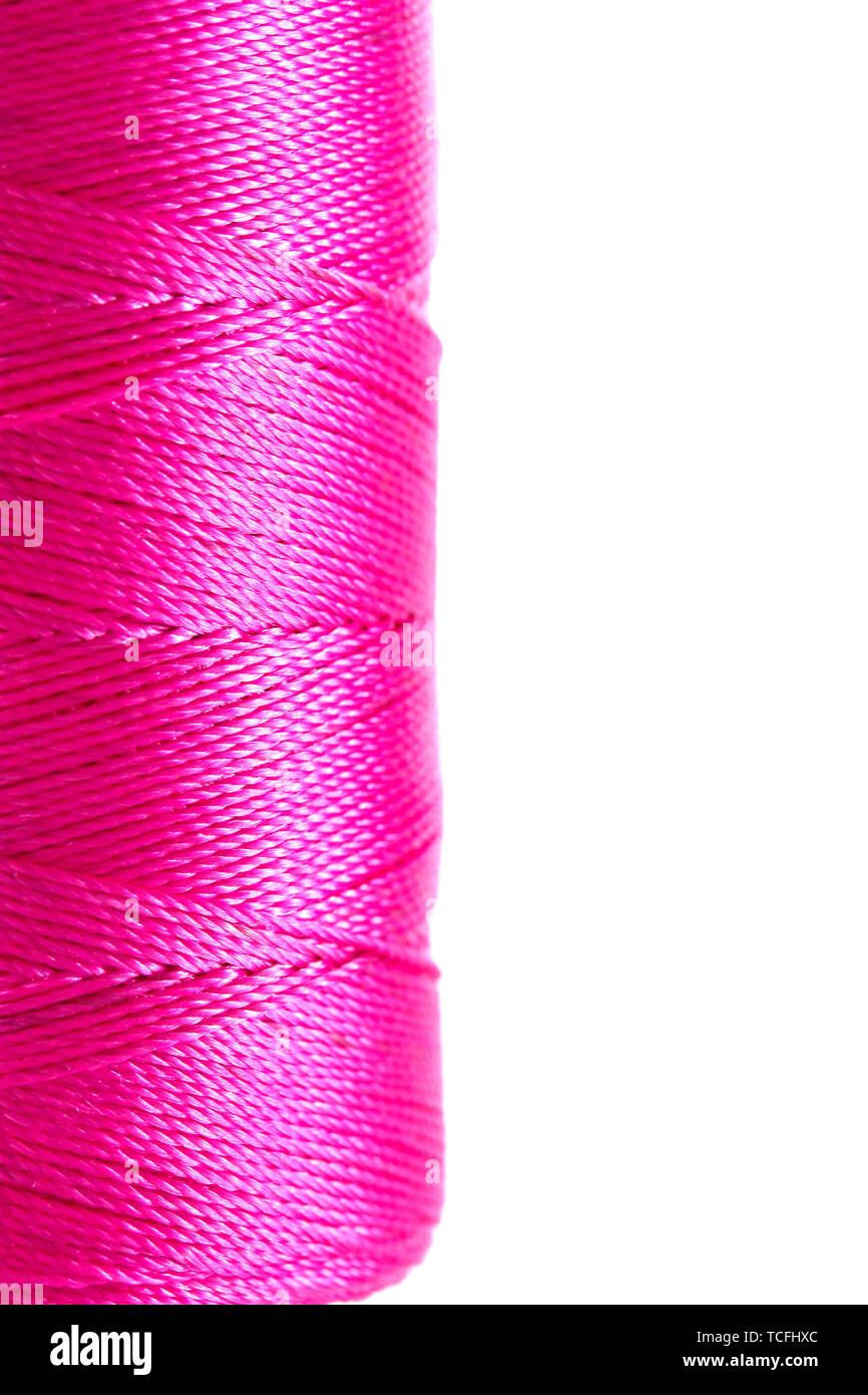 pink bobbin thread isolated on white Stock Photo - Alamy