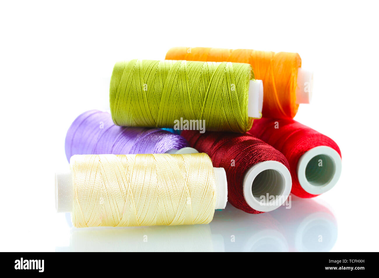 bright bobbin thread isolated on white Stock Photo - Alamy