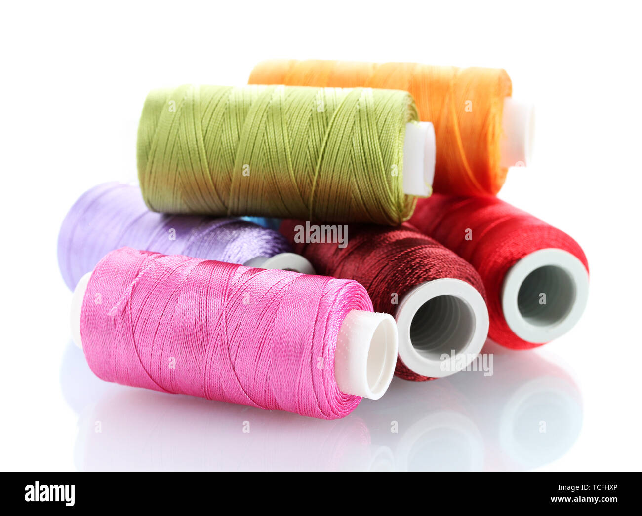 bright bobbin thread isolated on white Stock Photo - Alamy