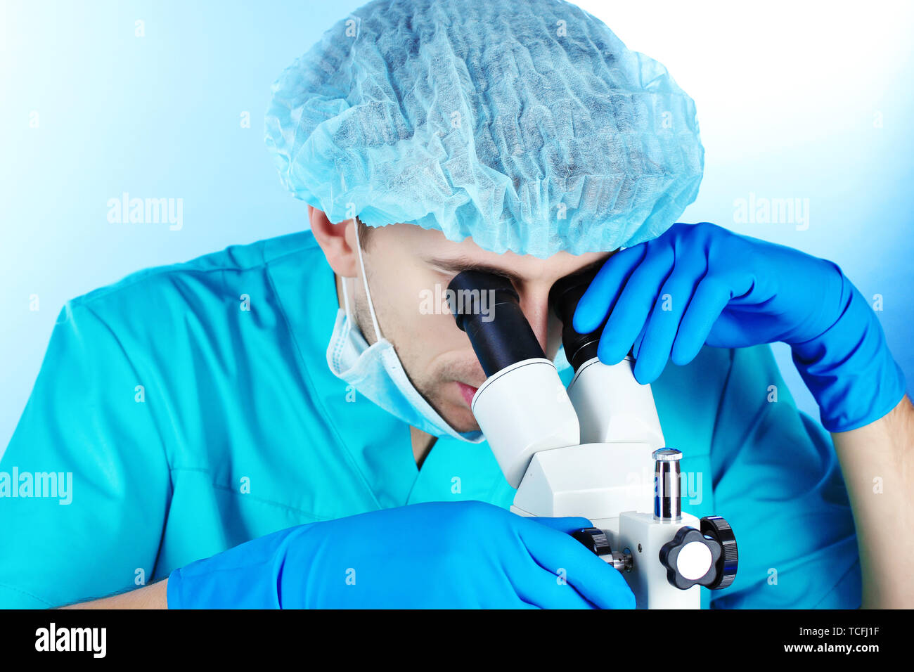 scientist in the lab working with microscope Stock Photo - Alamy