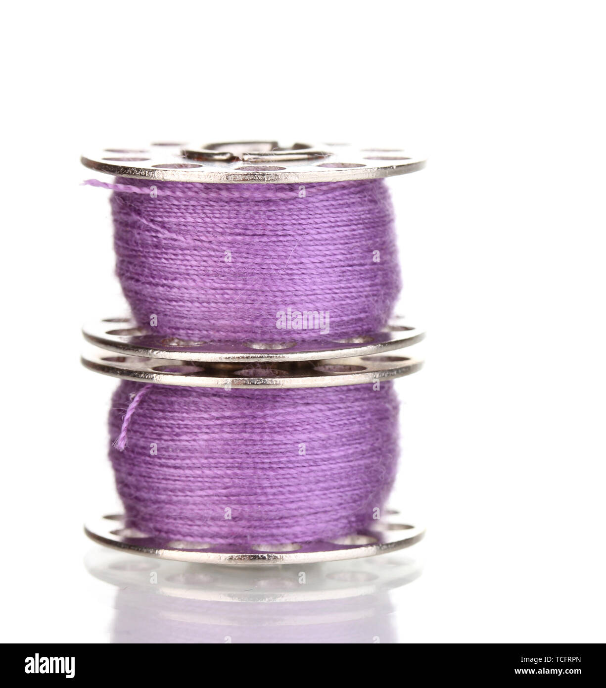 Metal spools of thread isolated on white Stock Photo - Alamy