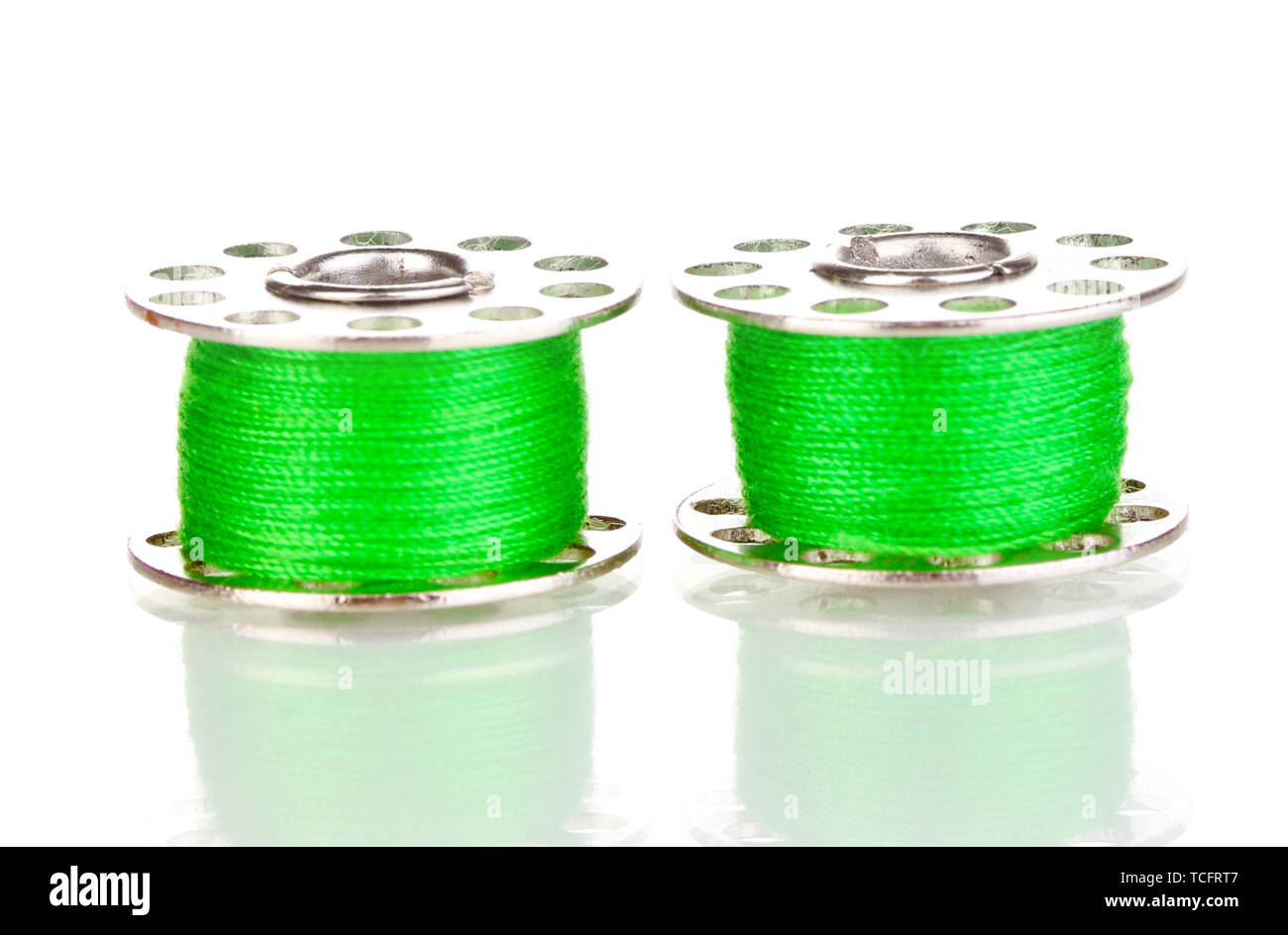 Metal spools of thread isolated on white Stock Photo - Alamy