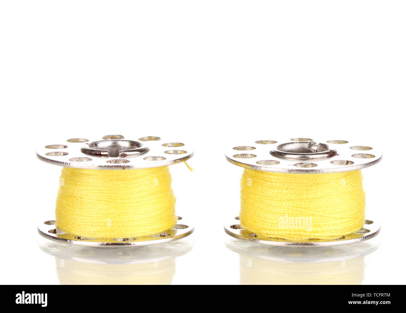 Metal spools of thread isolated on white Stock Photo - Alamy